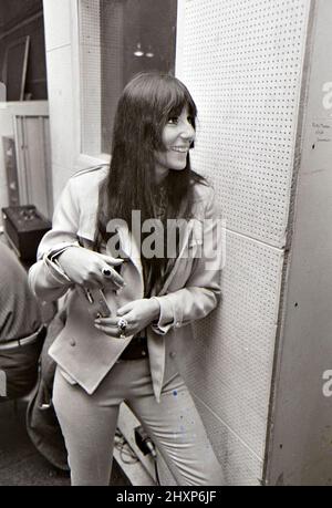 SONNY AND CHER US singer Cher helps out on tambourine during a ...