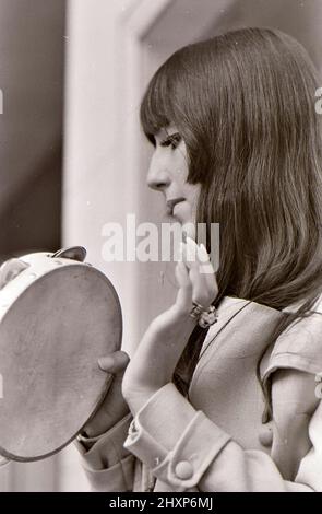 SONNY AND CHER US singer Cher helps out on tambourine during a ...