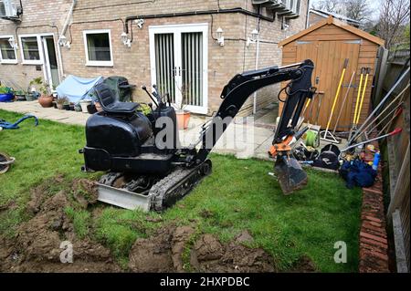 A small garden digger parked ready for use Stock Photo - Alamy