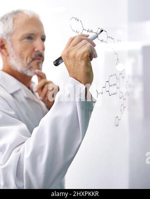 Cropped hand of scientist holding molecular structure in laboratory ...
