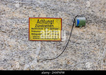 old warning sign ignition time in a mine Stock Photo - Alamy