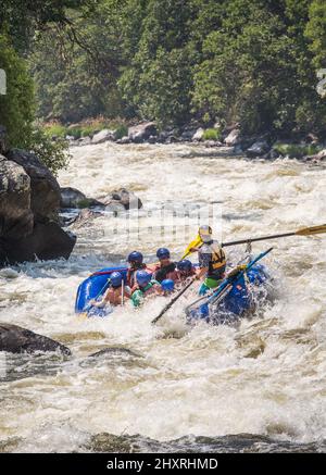 A raft rides into big whitewater Stock Photo - Alamy