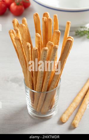 Grissini sticks. Traditional italian bread sticks on cutting board ...