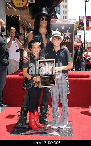 Musician Slash, sons Cash Hudson and London Hudson attending a ceremony ...