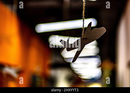 Selective of a paper plane hanging in a cafe Stock Photo - Alamy
