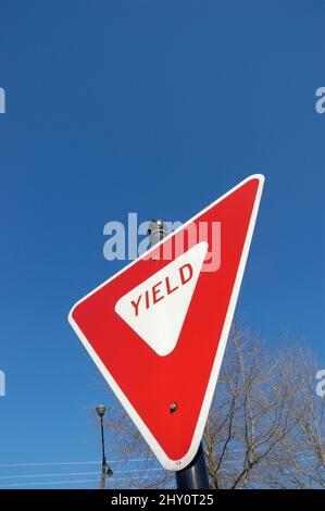 Yield Traffic Sign on roadway Stock Photo - Alamy