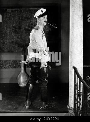 Silent film star Ben Turpin, in a western costume as a gaucho / cowboy ...