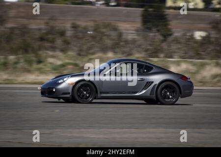 Dark gray Porsche car racing on a runway in Washington Stock Photo - Alamy