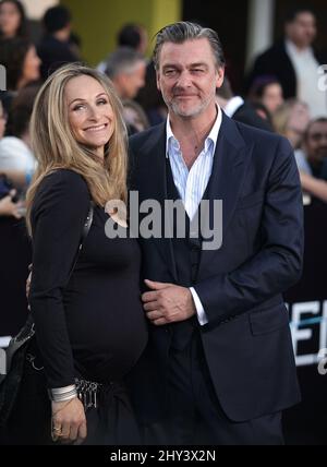 Ray Stevenson & Elisabetta Caraccia attending the 'Divergent' Premiere ...