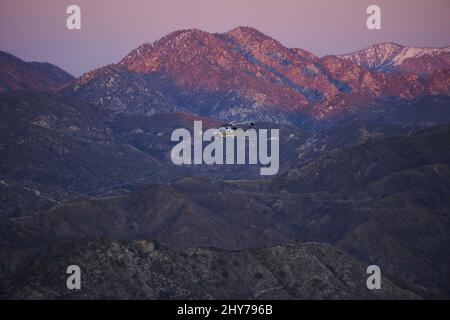 Beautiful view of a helicopter flying over the clouds with a blue sky ...
