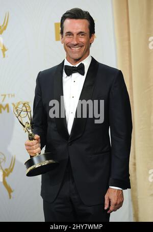 Jon Hamm poses in the press room with the award for best performance by ...