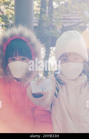 Portrait of an active girl in a protective mask, walking on a subway ...