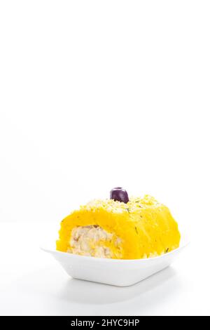 Closeup of a Peruvian food called causa made with chicken and mashed ...