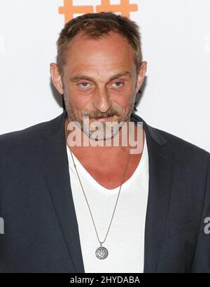 Roland Moller arriving at the "Papillon" premiere at the 2017 Toronto ...