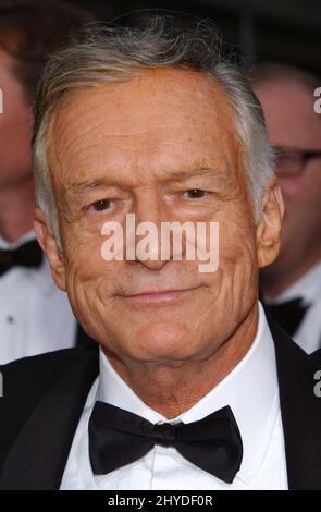 Playboy magazine publisher Hugh Hefner poses with "bunny-girl" hostess ...