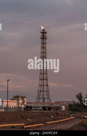 Vertical shot of a gas flare tower at a chemical plant in China Stock ...