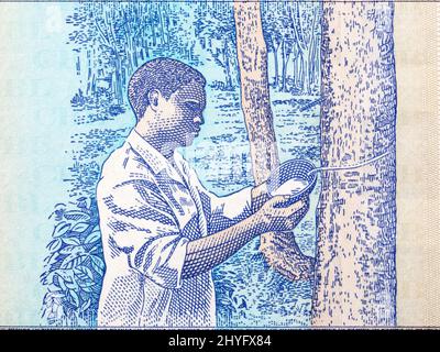 Rubber tapper from Liberian money Stock Photo - Alamy