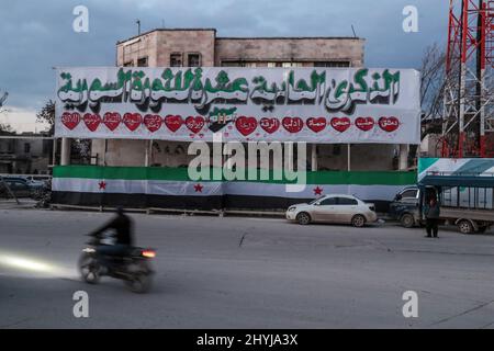 Idlib, Syria. 14th Mar, 2022. A large flag pole with the Syrian ...