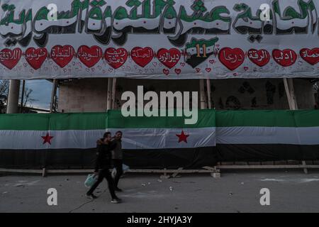 Idlib, Syria. 14th Mar, 2022. A large flag pole with the Syrian ...