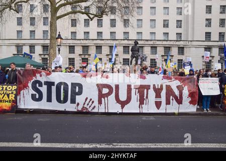 Protesters hold signs and banners at a Stop Adani Mine rally on the ...