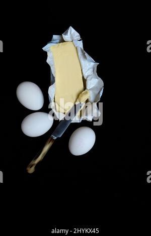 Butter in opened packaging and eggs Stock Photo - Alamy