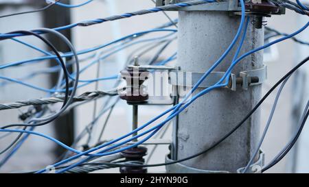 Messy wires from electric poles chaotic mess Stock Photo - Alamy