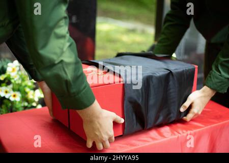 Burial of remains of soldier. Burial ceremony of war hero. Black ...