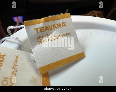 Close-up of label for Teavana Peach Tranquility atop a container of ...