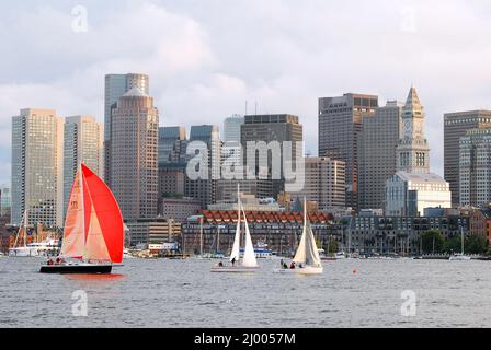Sailboat in harbor with Boston skyline at sunset and vibrant sky Stock ...
