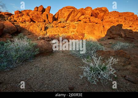Namibian sunset landscape with big red rocks Stock Photo - Alamy