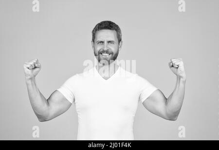 I am strong. Strong man grey background. Fit guy show strength. Muscle ...