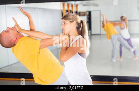 Woman practicing basic palm strike in self defense training Stock Photo ...