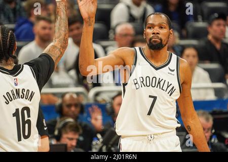 Brooklyn Nets' Kevin Durant (7) high-fives teammates Joe Harris (12 ...