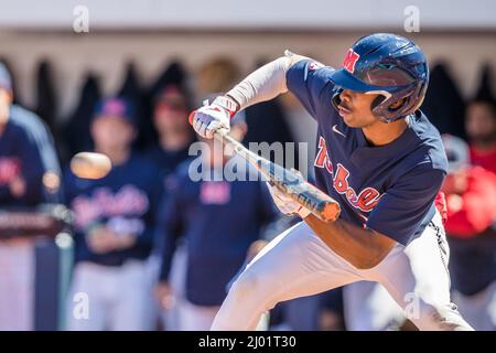 March 13, 2022: Ole Miss catcher Hayden Dunhurst (13) takes a swing ...