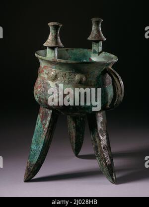 This large ritual wine warmer, or Jia, features whorls and spirals ...