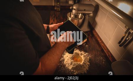 Professional chef checking the ingredients and using his hands for ...