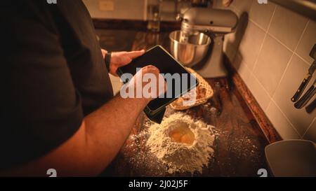 Professional chef checking the ingredients and using his hands for ...