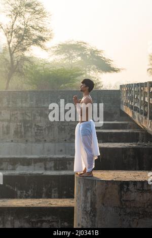 Young man praying to God outdoors Stock Photo - Alamy