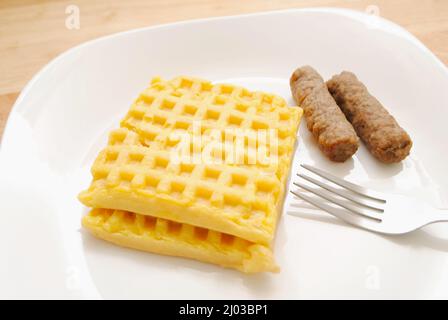 Two Square Waffles Served with Sausage Links Stock Photo - Alamy