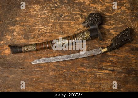Ornately carved Tumbuk Lada dagger from the 19th century. It's a steel ...