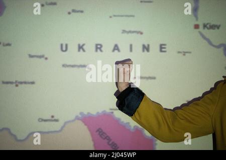 Woman lecturer points at Ukraine on a map of Eastern Europe Stock Photo ...
