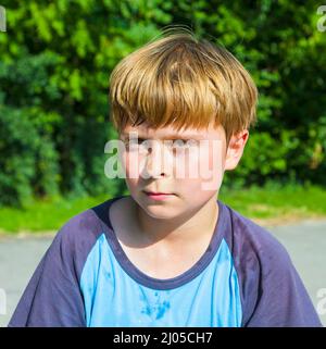 cute boy looks confident and happy Stock Photo - Alamy