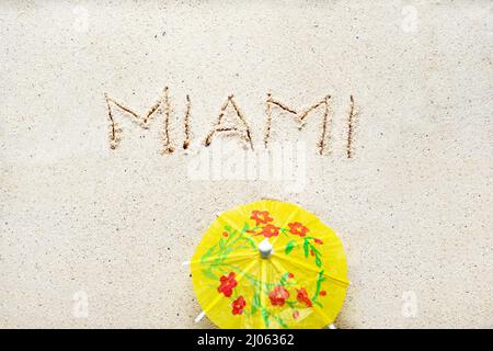 Handwriting words "Miami" on sand of beach Stock Photo - Alamy