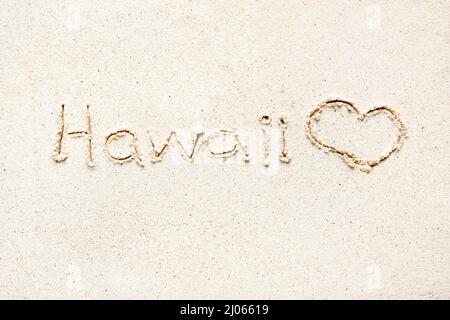 Handwriting words "Hawaii" on sand of beach Stock Photo - Alamy
