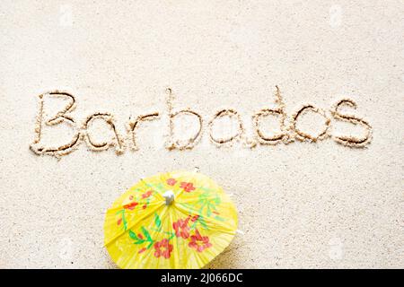 Handwriting words "Barbados" on sand of beach Stock Photo - Alamy