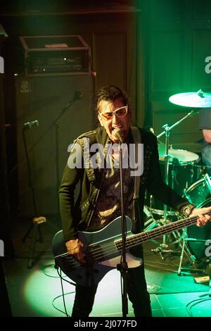 Bassist Pando performing with eighties New Wave band A Flock of ...