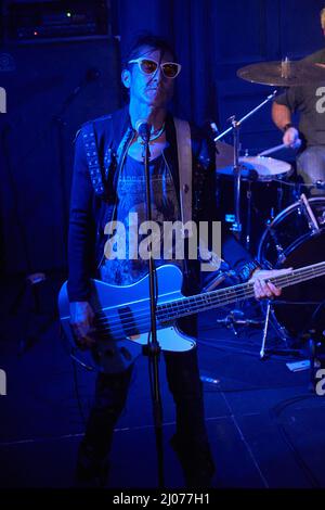 Bassist Pando performing with eighties New Wave band A Flock of ...