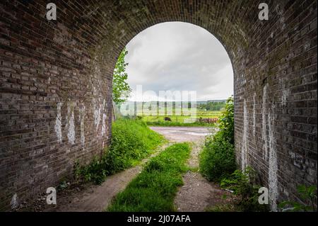 Old brick railway underline train bridge in Amberley, West Sussex ...