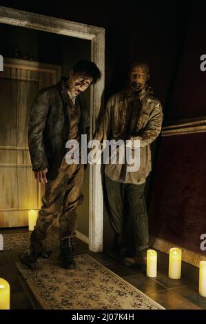 Zombie house with candlelight and scary corpse Stock Photo - Alamy