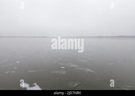 Frozen lake, dark depressing winter landscape Stock Photo - Alamy